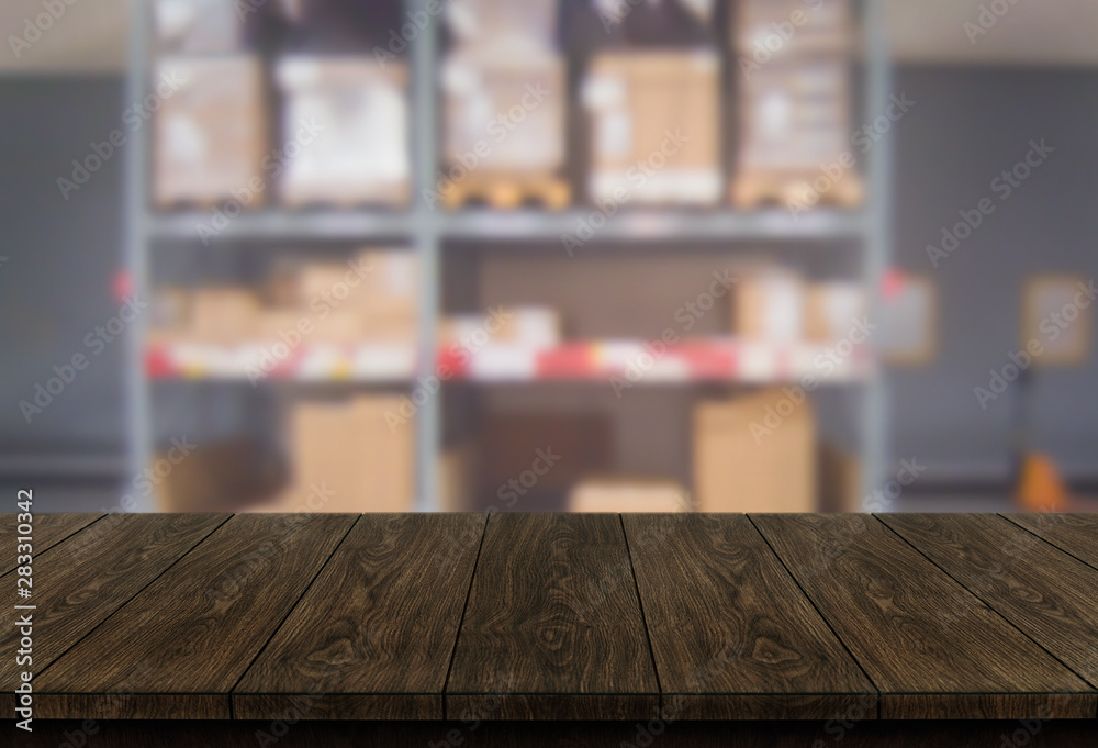 Wood table in warehouse storage blur background with empty copy space ...