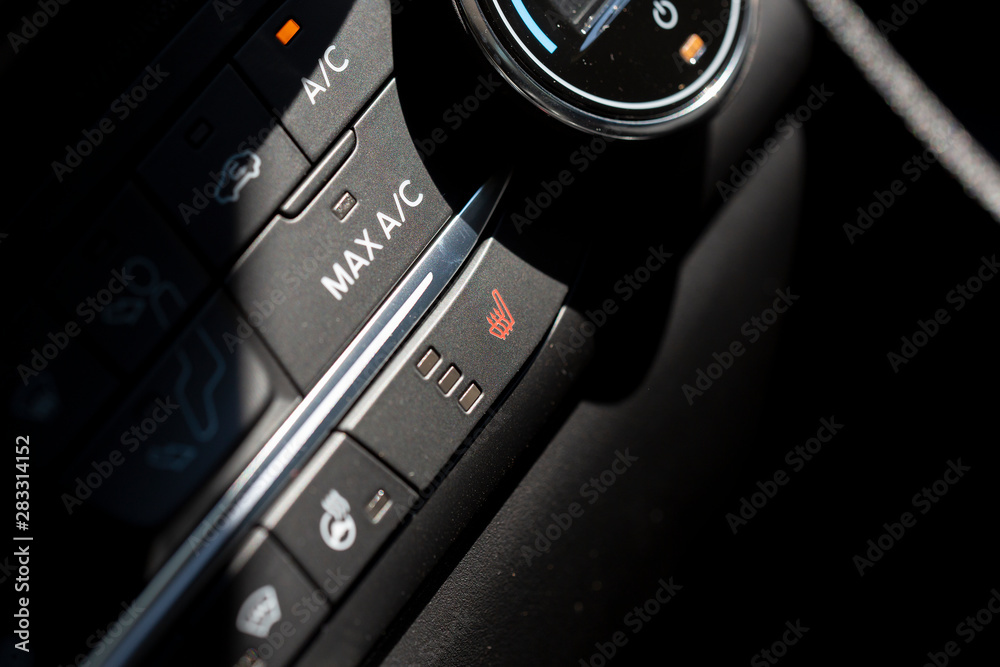Seat heater button on a modern car. Maximum power button for air ...