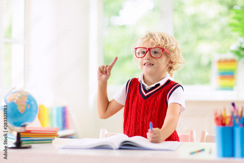 Kids doing homework. Children go back to school. Stock Photo | Adobe Stock