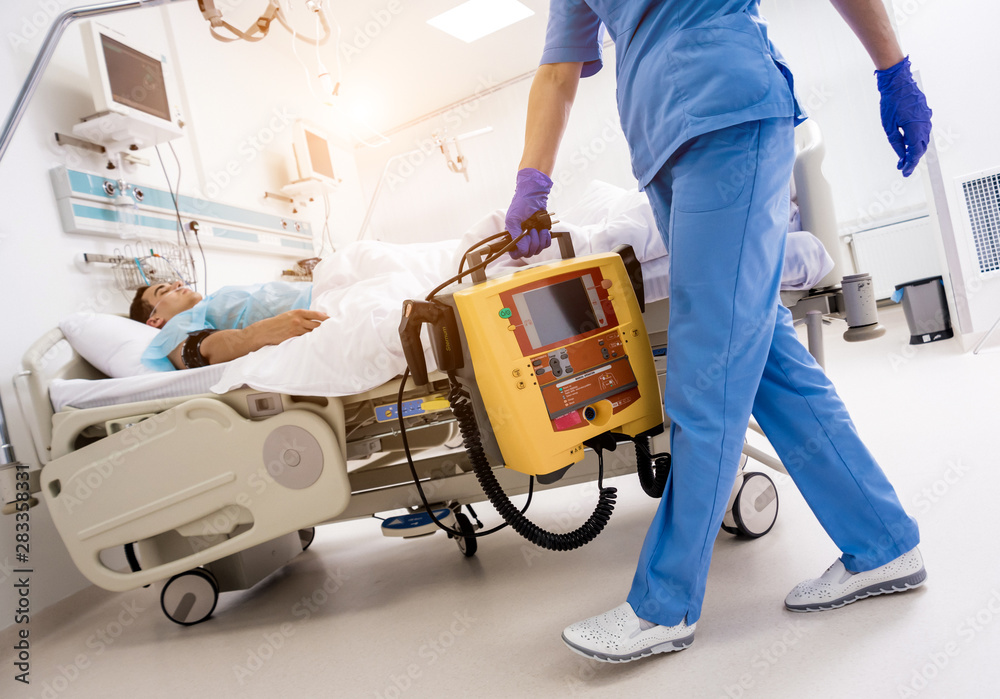 Doctors give resuscitation to a male patient in the emergency room ...