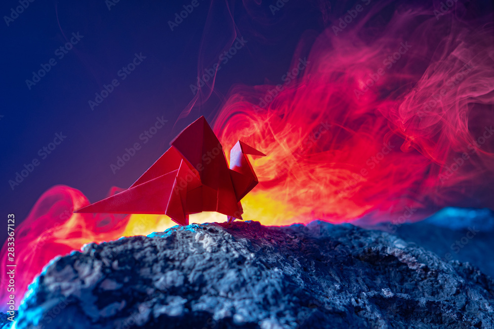 Dragon made of paper. Red Paper Draco Origami. Draco stands in the ...