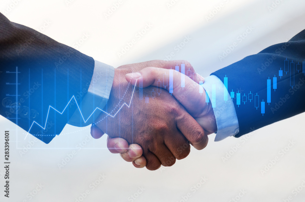 Partnership. business man handshake with graph chart of stock market ...