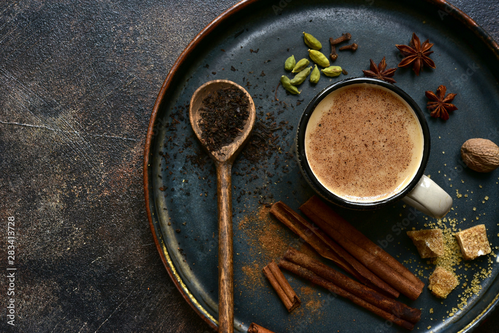 Traditional indian masala tea with ingredients for making. Top view ...