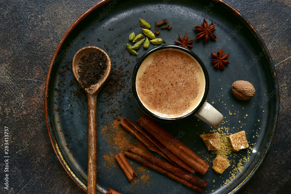 Traditional indian masala tea with ingredients for making. Top view ...