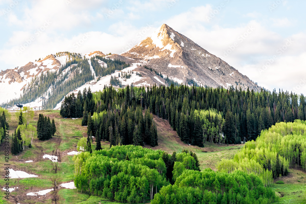 Mount Crested Butte Colorado snow peak in summer with view of colorful ...