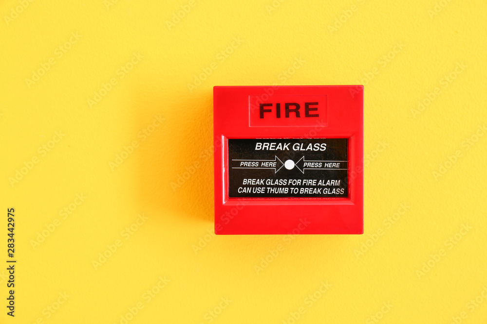 Modern manual call point of fire alarm system on color wall Stock Photo ...