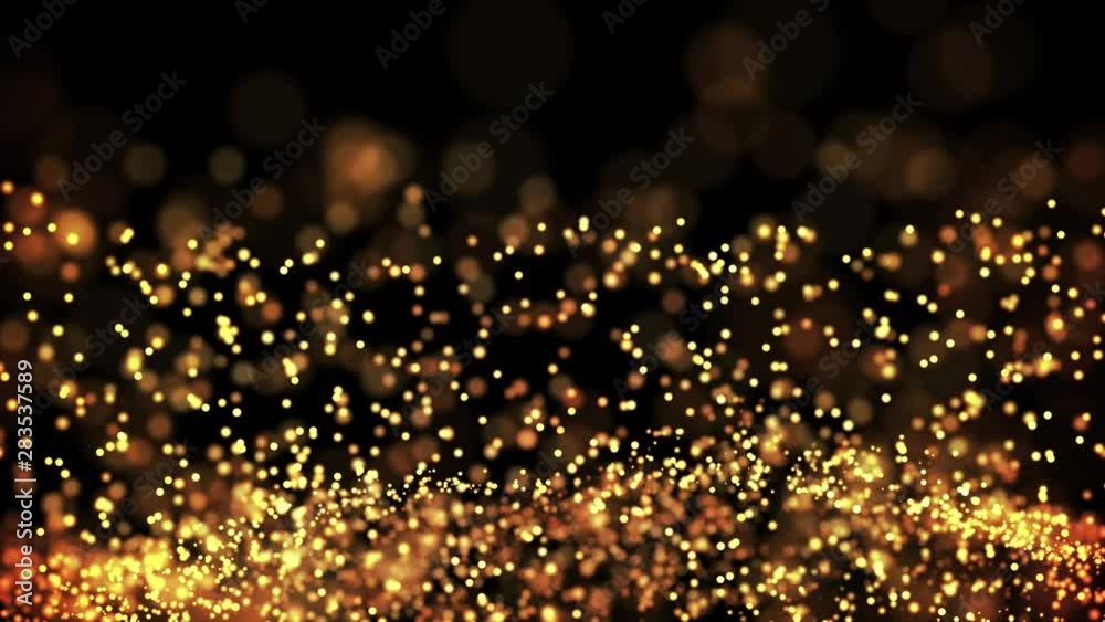 gold shiny sparkling particles move in a viscous liquid. It is bright ...