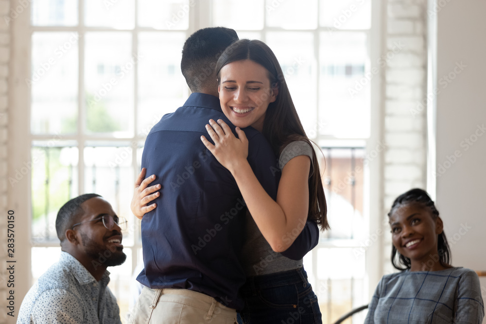 Relieved happy man and woman embrace give support during therapy Stock ...