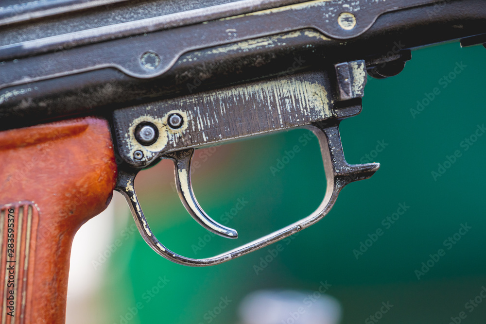 The trigger of the machine gun . The machine gun is ready for firing ...