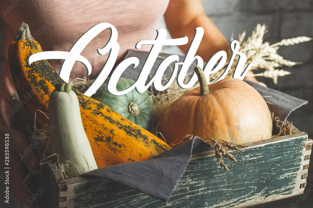 October text on autumn vegetables in wooden box. Close up. Farm ...