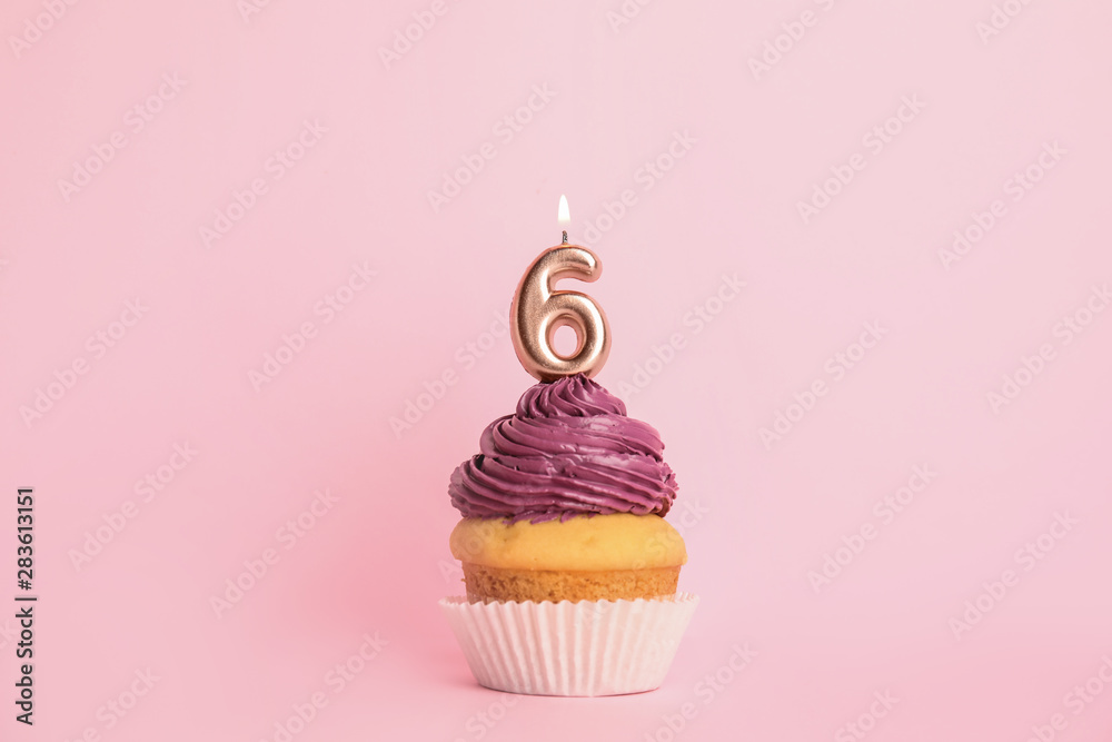 Birthday cupcake with number six candle on pink background Stock Photo ...