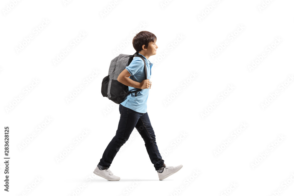 Schoolboy with a backpack walking Stock Photo | Adobe Stock