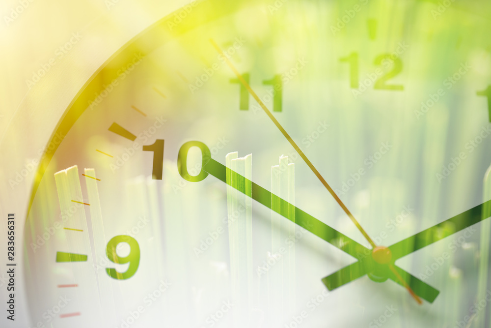 Times clock face overlay with green grass nature background. time to ...