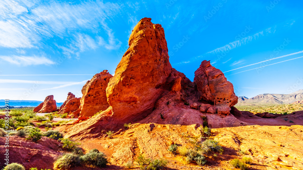 Sunrise over the bright red Aztec sandstone rock formation of the Seven ...