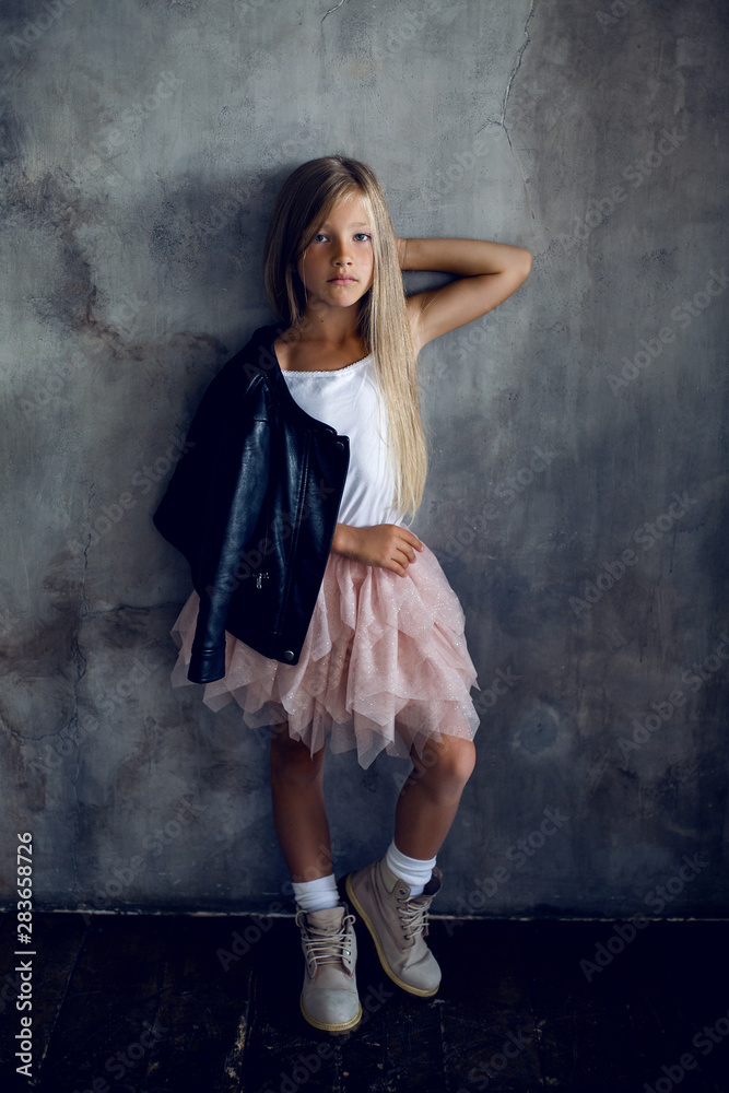 fashionable girl model in a leather jacket skirt and shoes Stock Photo ...