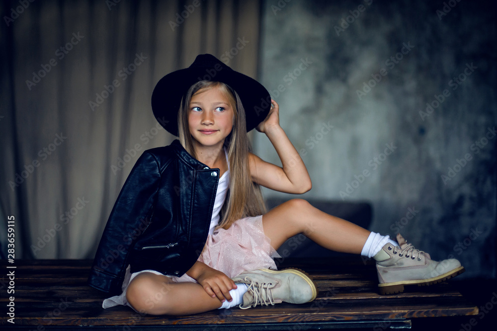 fashionable girl model in a leather jacket skirt and shoes Stock Photo ...