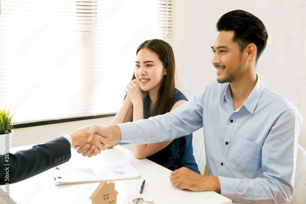 Picture of a serious Asian female salesman Sit in a modern office room ...