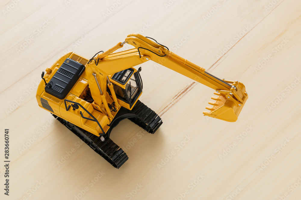 Excavator loader on a wood background with lift up bucket,Top view ...