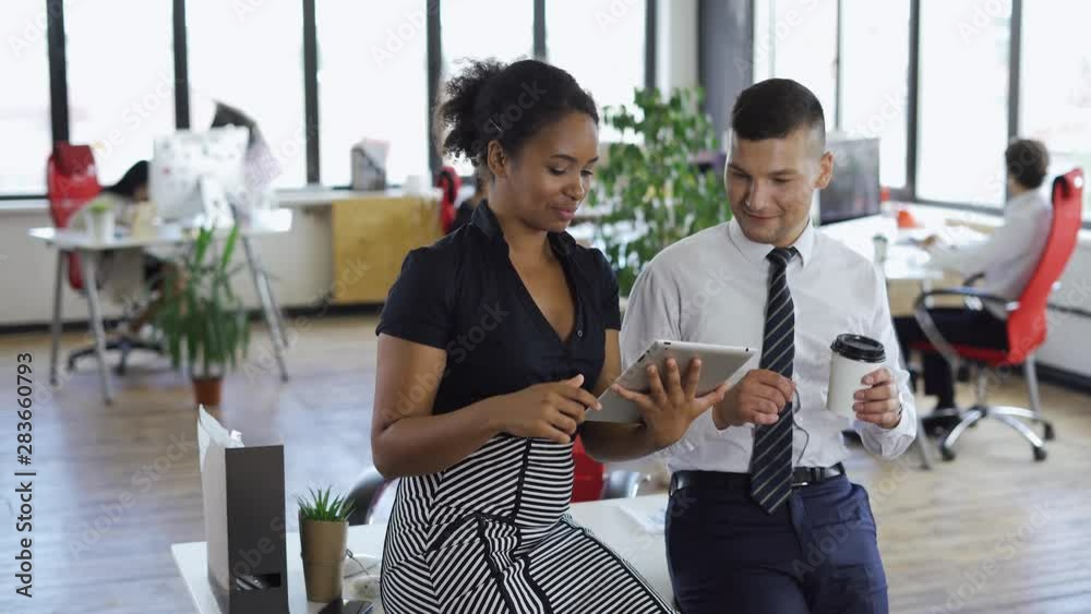 international teamwork in modern office, man and african women manager ...