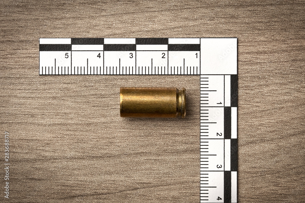 Crime Scene Investigation - bullet casing as a piece of evidence placed ...