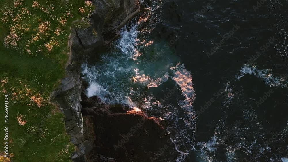 AERIAL TOP DOWN RISING Sea waves hitting on Carrowmore Lacken rock ...