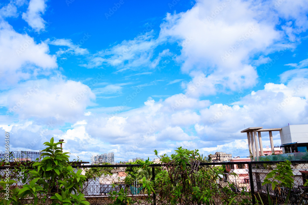 Clouds over rooftop of house and high building in Kolkata, India ...