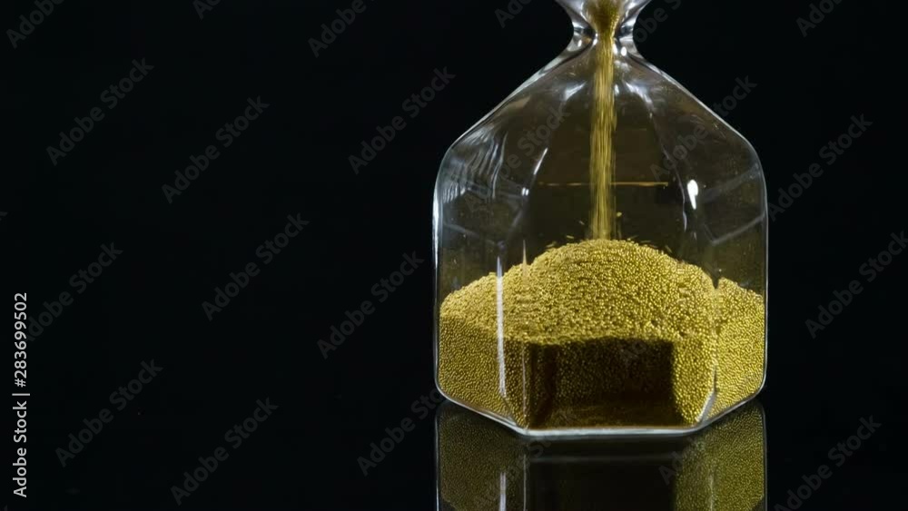 Vidéo Stock Time as the Most Expensive. An hourglass in an old style on ...