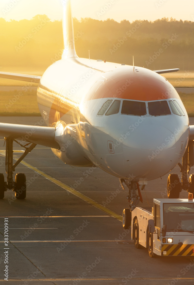 TUG Pushback tractor with Aircraft on the runway in airport. Stock ...