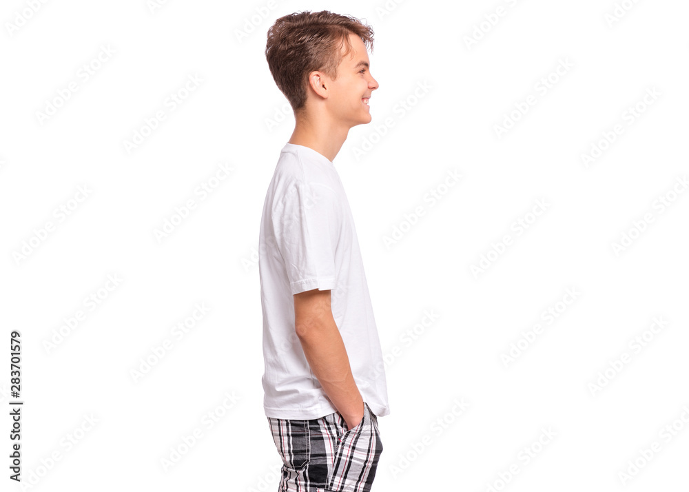 Side view of portrait of teen boy in blank white t-shirt, isolated on ...