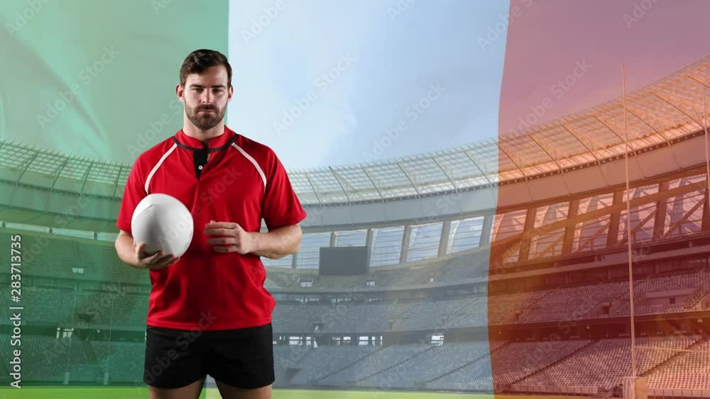 Professional rugby player standing in front of a flag and stadium Stock ...