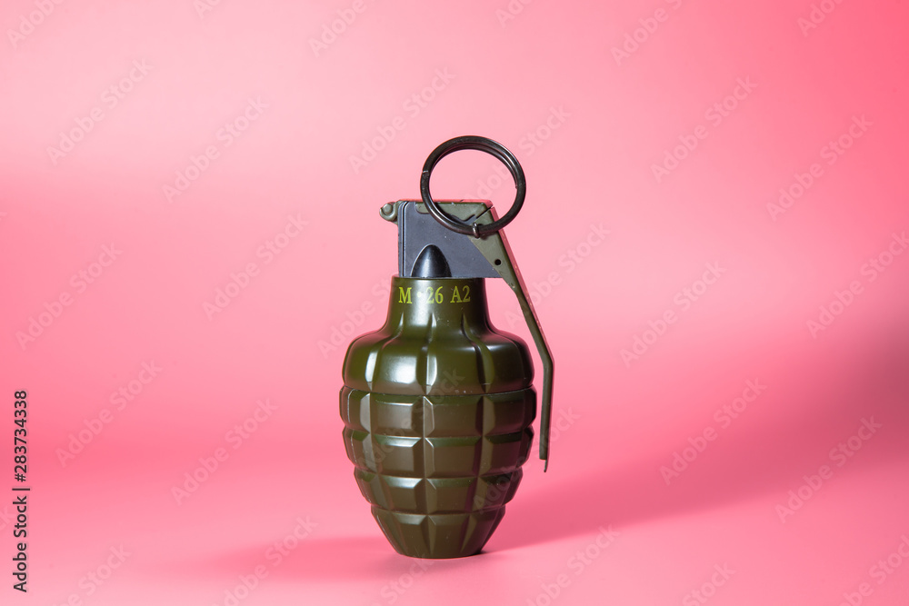 Green metal hand Grenade with round pin over When I pull out it will ...