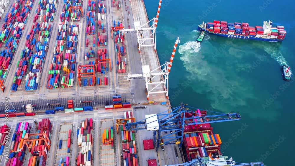4K Timelapse of modern industrial port with containers from top view or ...
