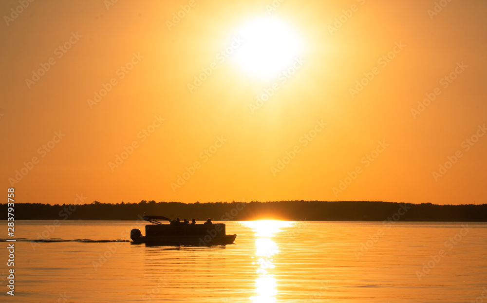 Pontoon Boat at Sunset Stock Photo | Adobe Stock