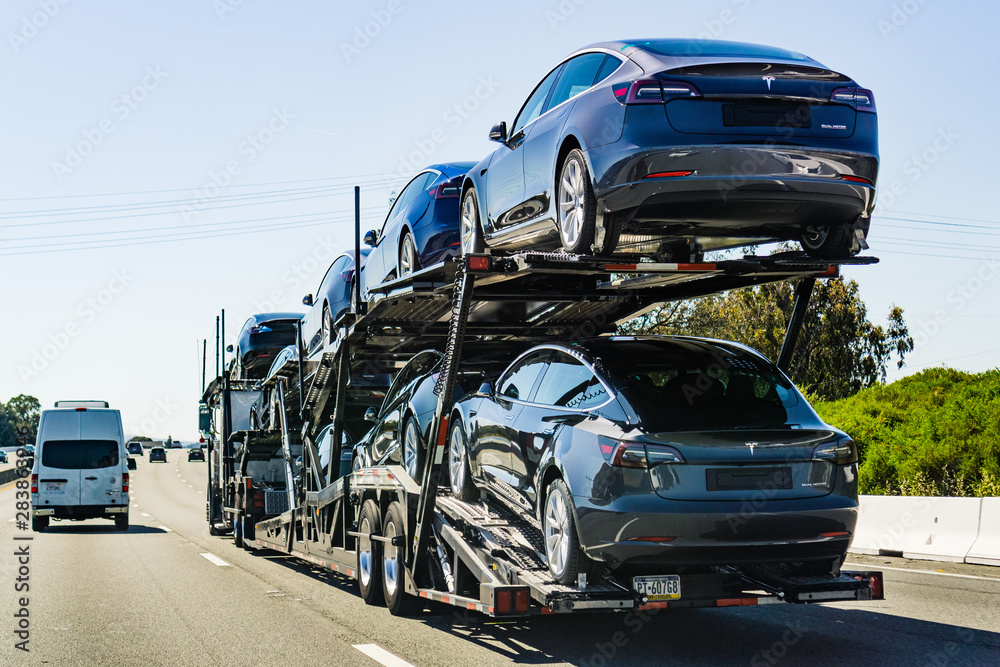 July 4, 2019 Redwood City / CA / USA - Car transporter carries Tesla ...
