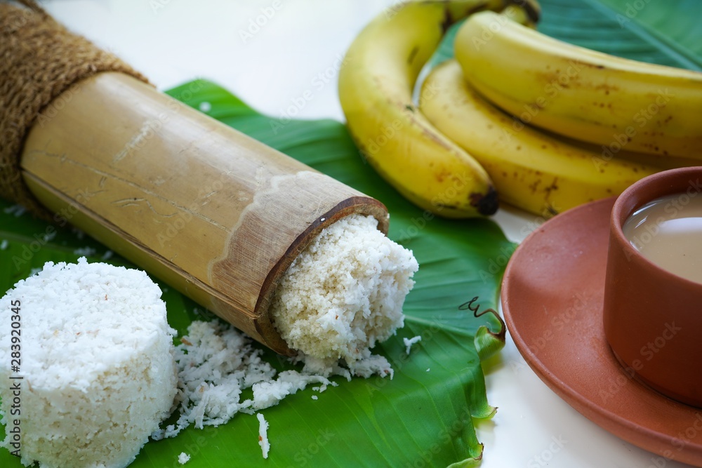 Kerala breakfast rice Puttu /Pittu made in bamboo mould served with ...