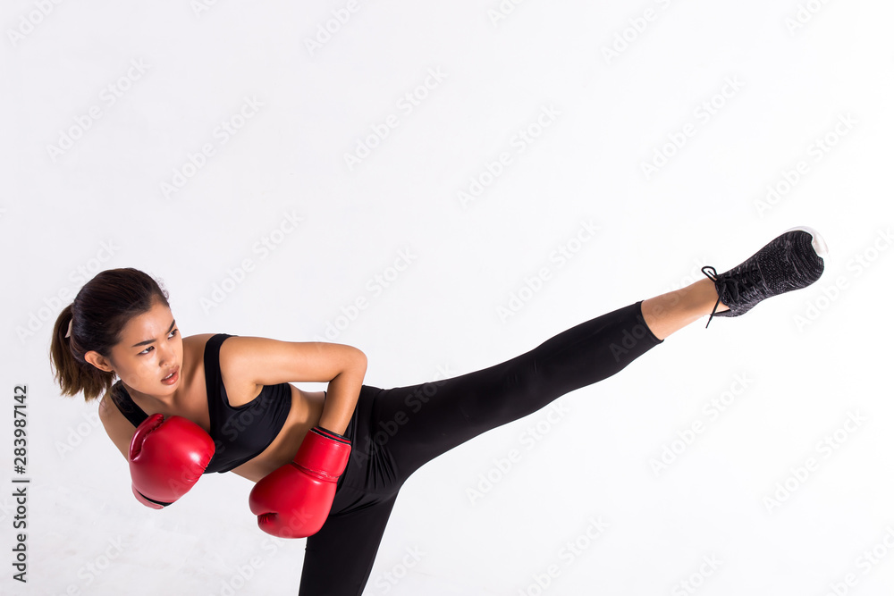 Young Asian woman in black sportswear and red leather boxing gloves ...