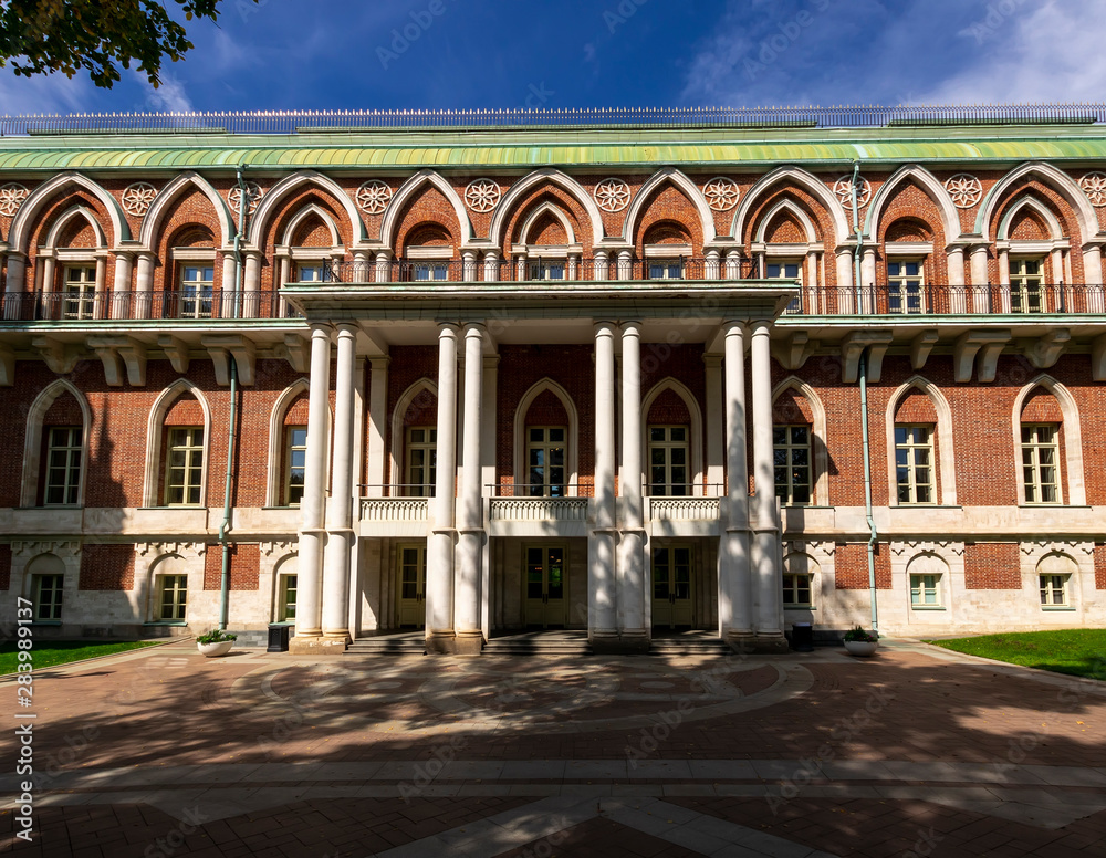 red palace brick wall with gates, facade of medieval castle Stock Photo ...