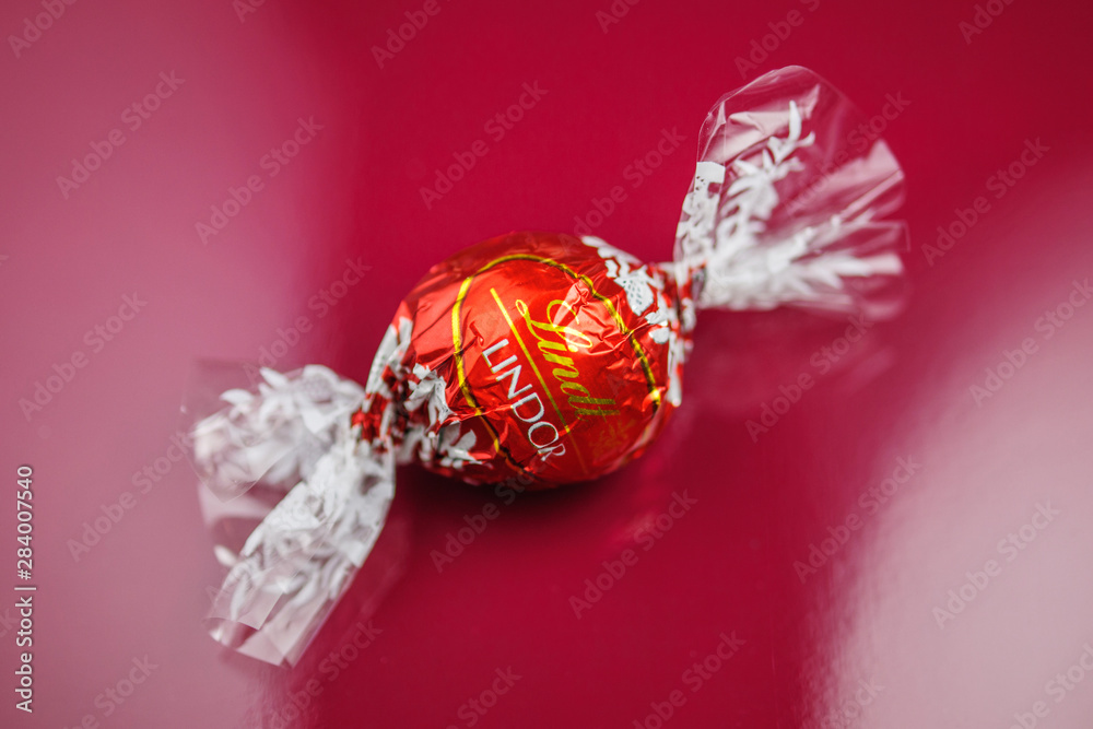 KILCHBERG, SWITZERLAND - MARCH 20, 2014: Lindt Lindor chocolate truffle ...