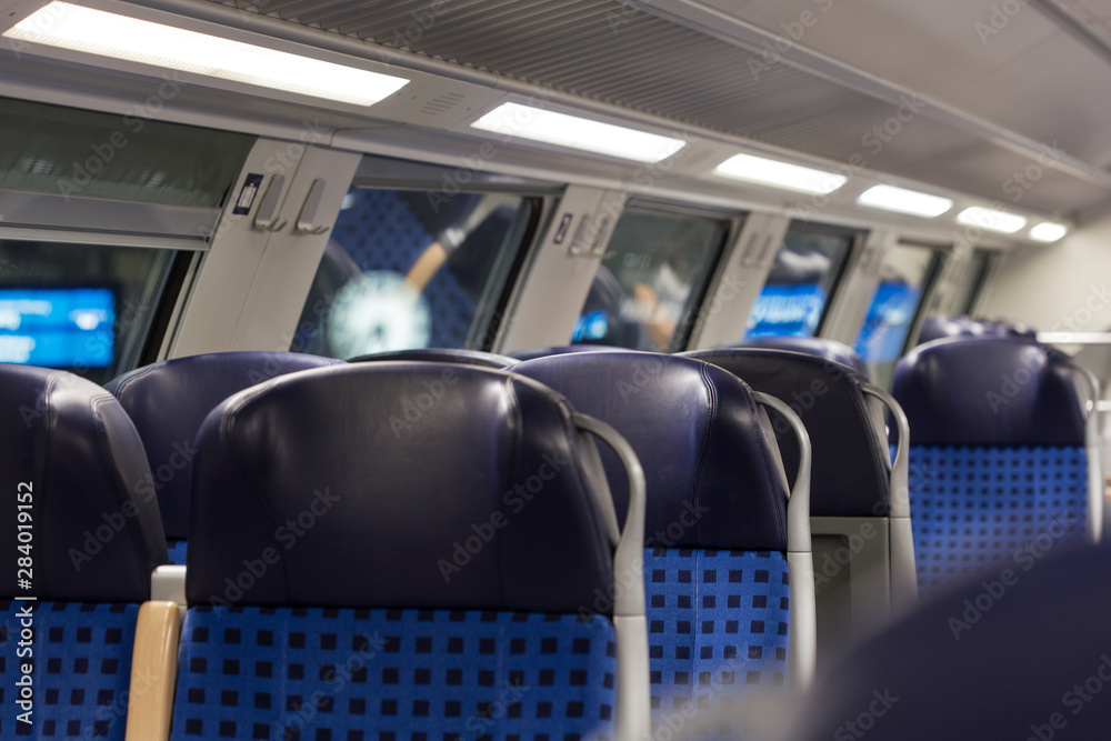 seats in a second-class german regional double-decker train; the train ...