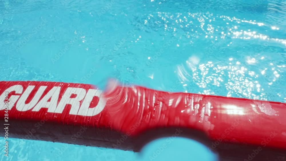 Stockvideo Red lifeguard float being thrown into a swimming pool. The ...
