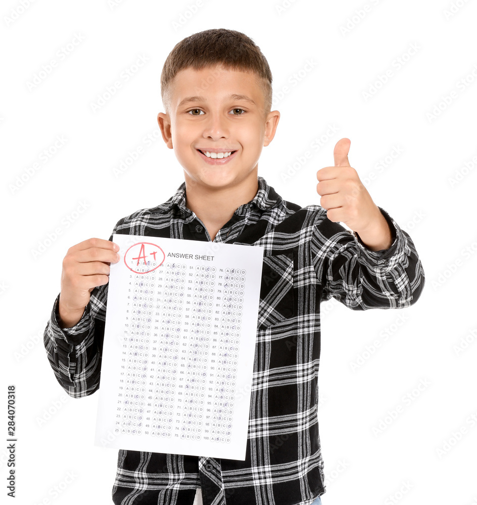Happy boy with answer sheet for school test on white background Stock ...