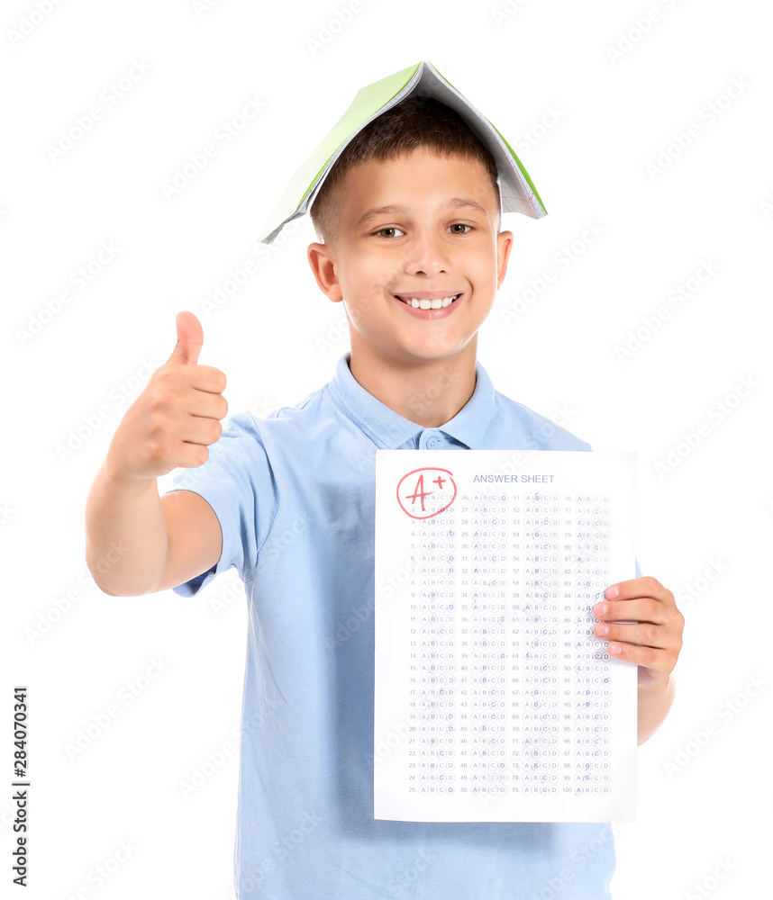 Happy boy with answer sheet for school test on white background Stock ...