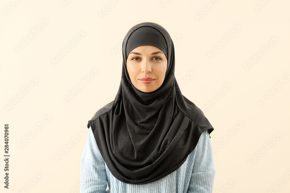Portrait of Muslim woman on light background Stock Photo | Adobe Stock