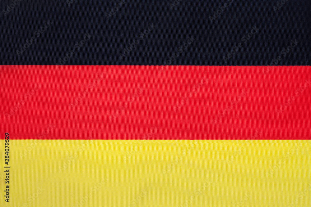German national fabric flag, textile background. Symbol of ...