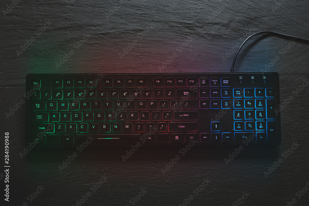 Computer keyboard with rgb light on black background with copy space ...