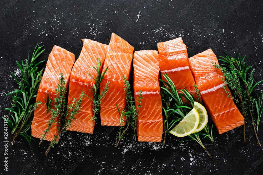 Salmon. Fresh raw salmon fish fillet with cooking ingredients, herbs ...
