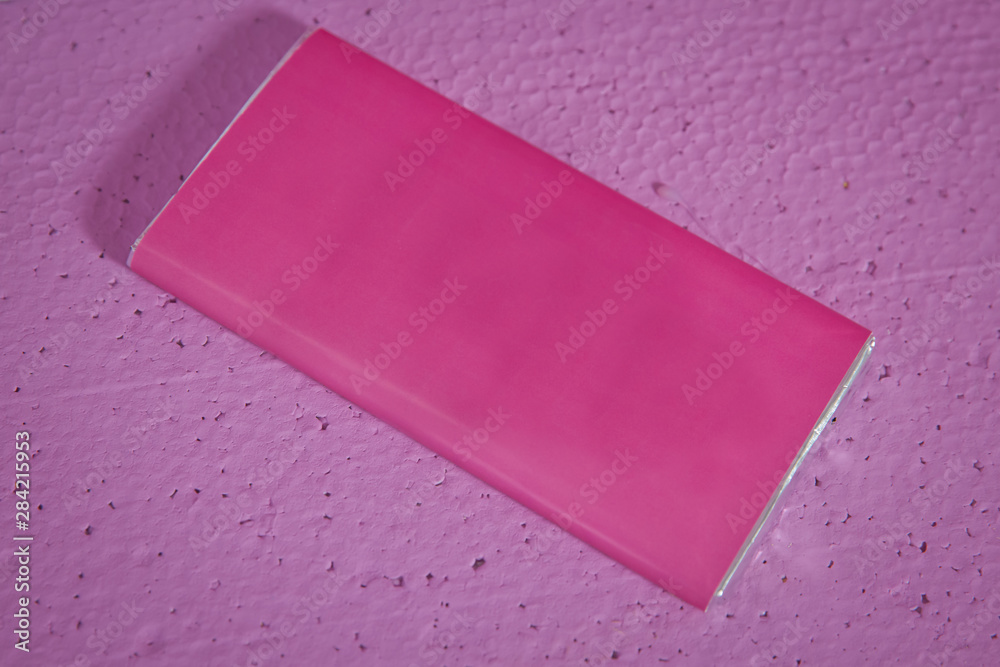 Design concept. Blank paper chocolates package isolated on pink . close ...