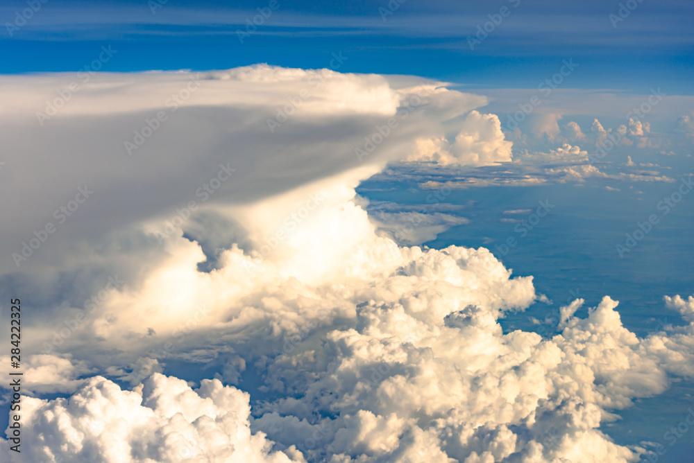 Big and fluffy clouds, top view. Cascades of white clouds in a blue sky ...