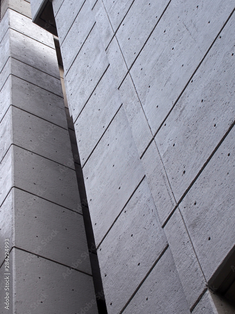angles and corners on the exterior wall of a concrete brutalist ...