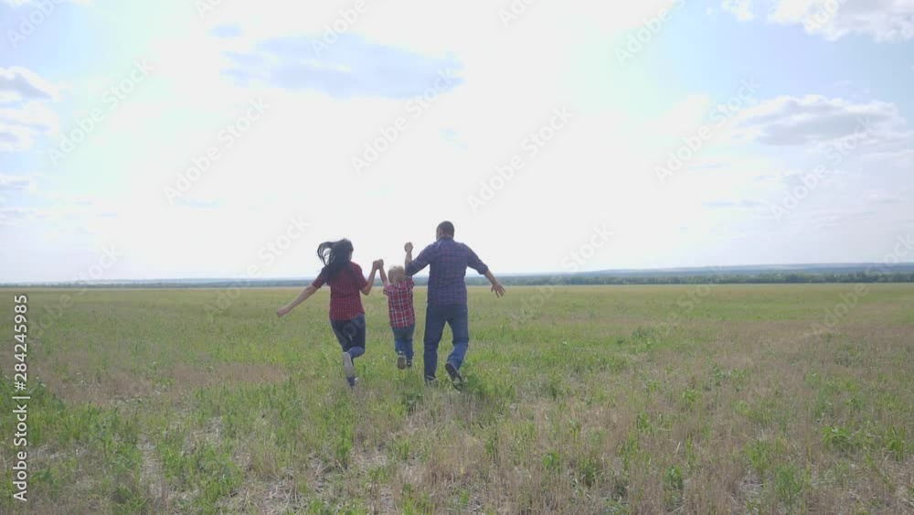 happy family run teamwork concept slow motion video. father mom and son ...